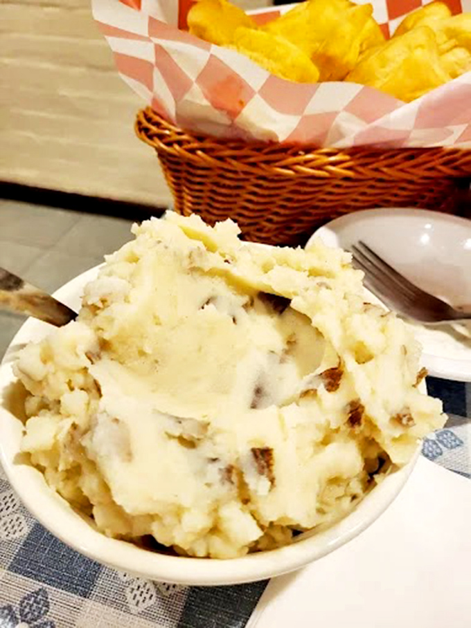 These mashed potatoes aren't whipped into submission by some fancy machine – they've got character, texture, and enough butter to make your cardiologist wince.