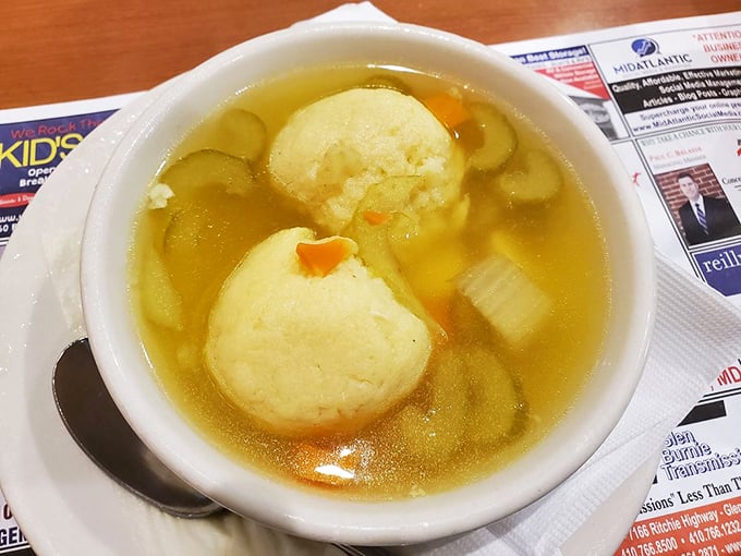 Matzo ball soup that could heal whatever ails you – golden broth cradling dumplings so light they practically float to your spoon.