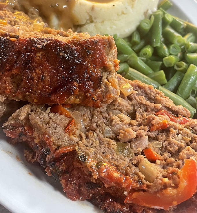 Meatloaf that would make your grandmother both proud and jealous. Served with mashed potatoes and green beans, it's comfort food elevated to an art form.