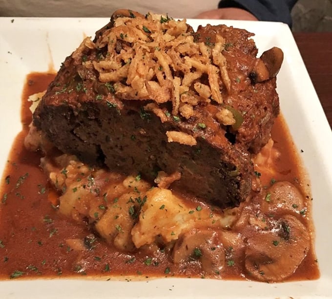 Meatloaf that would make your grandmother simultaneously proud and jealous, swimming in a sauce worth bottling and taking home.