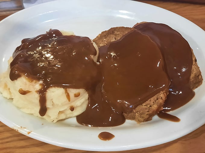 Meatloaf swimming in gravy – comfort food that hugs you from the inside. This plate makes Monday feel like a warm Saturday afternoon.