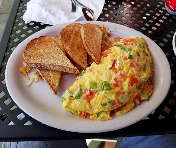 Colors that pop and flavors that dance—this omelet brings the fiesta to your morning with enough cheese to make Wisconsin proud.