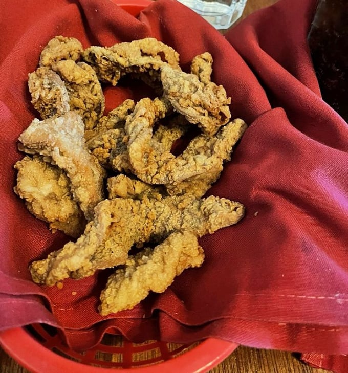 Mountain Oysters for the brave of heart. These crispy morsels nestled in their red basket aren't your typical appetizer—they're a Central Oregon rite of passage.