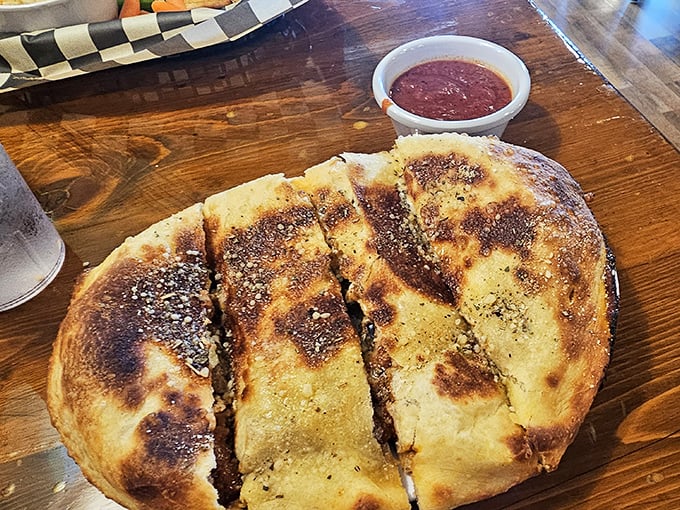 Golden, crispy, and stuffed with goodness—this calzone is what happens when bread and fillings have a beautiful romance.