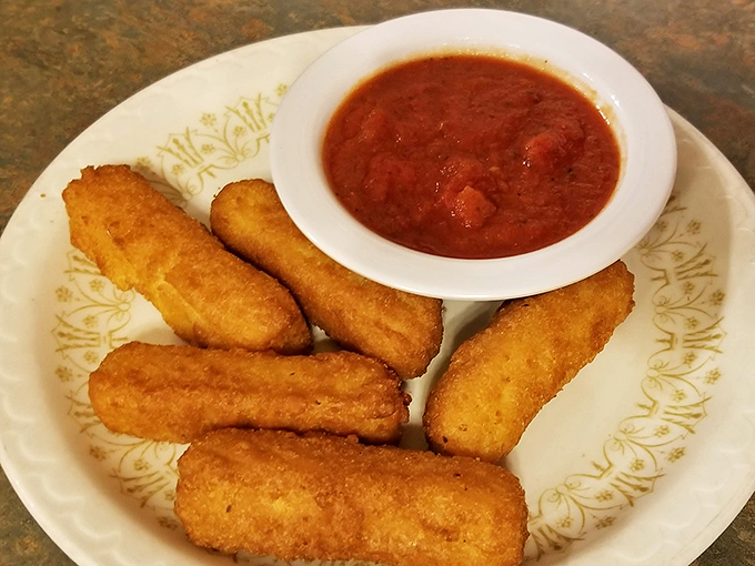 Golden-fried mozzarella sticks with marinara—proof that simple pleasures are often the most satisfying. Crispy outside, molten inside, perfect always.