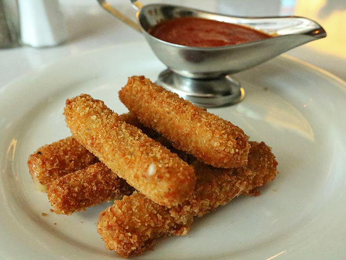 Mozzarella sticks: the diplomat of appetizers. Crispy golden exterior, molten cheese interior, and marinara for dipping—bringing peace to tables since diners began.