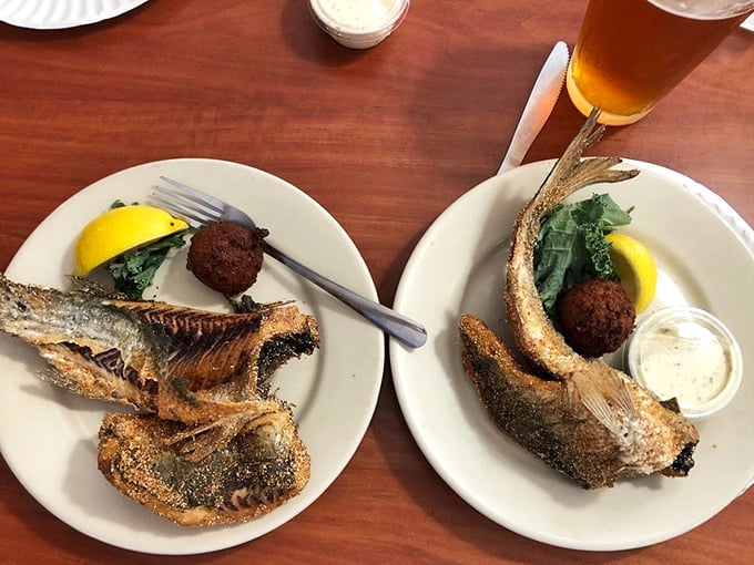 Whole butterflied mullet with hushpuppies—the dish that separates Florida seafood tourists from the true connoisseurs.