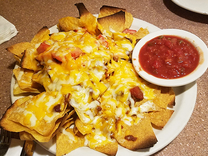 Nachos that understand the importance of proper cheese distribution – a structural engineering feat that puts some bridges to shame.