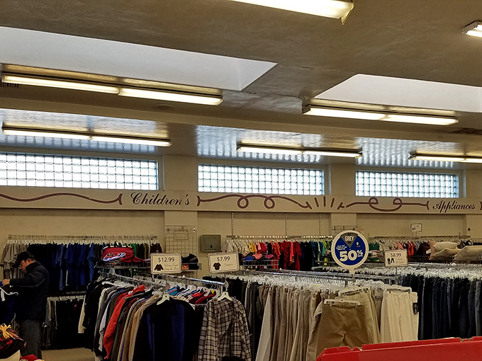 The children's section neighbors appliances in a retail layout that makes as much sense as life itself—chaotic but somehow functional.