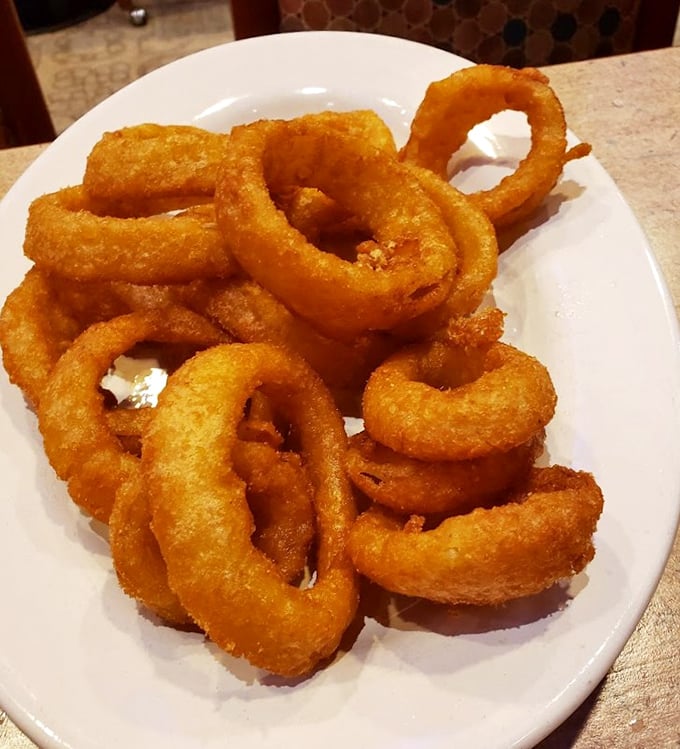 These onion rings aren't just side dishes, they're golden halos of crispy perfection that demand to be the main event on your table.