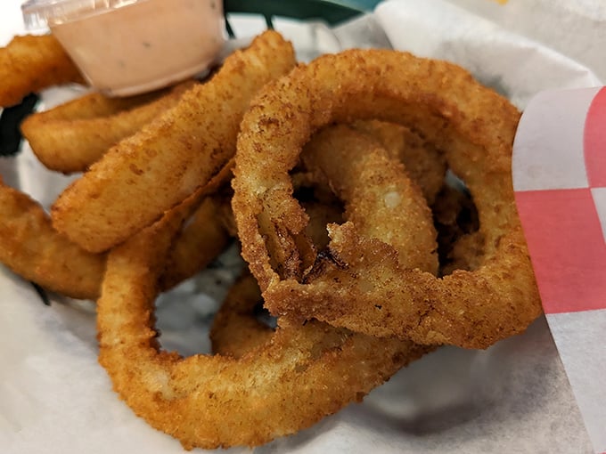 Golden halos of deep-fried perfection. These onion rings aren't just sides – they're the supporting actors that deserve their own Oscar.