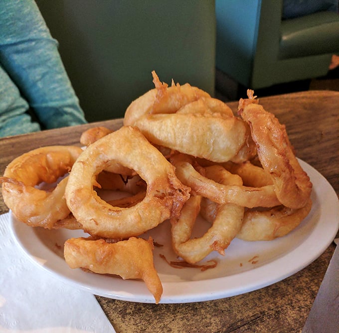 These golden onion rings aren't just a side dish—they're crispy halos of happiness that crunch with each bite, making any meal feel like a celebration.