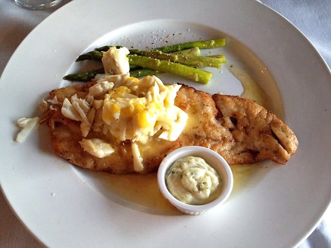 Pan-seared snapper with a side of asparagus—proof that sometimes the simplest preparations let truly fresh ingredients sing their siren song.
