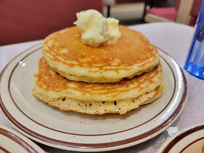 Golden pancakes stacked high with a melting pat of butter—architecture so beautiful it should require a building permit.