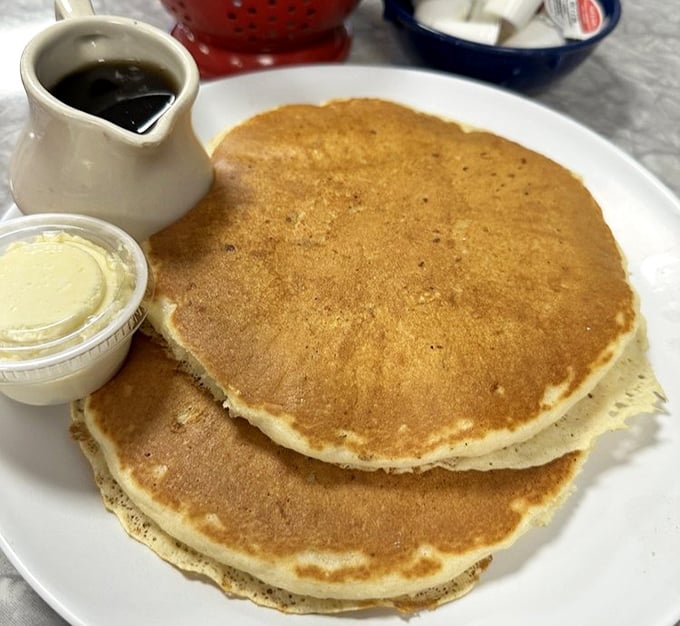 Pancakes stacked like vinyl records from your youth—golden-brown, perfectly round, and about to drop the hottest breakfast beat in Ohio.