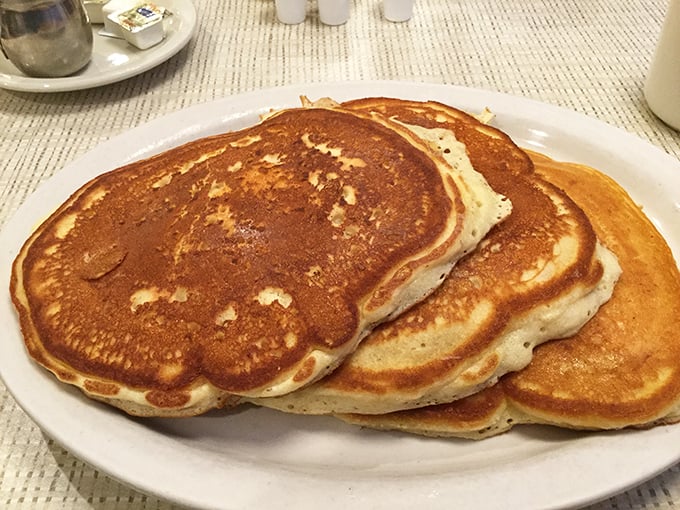 These golden-brown pancakes aren't just breakfast, they're edible sunshine—the kind of simple perfection that makes Monday mornings bearable.