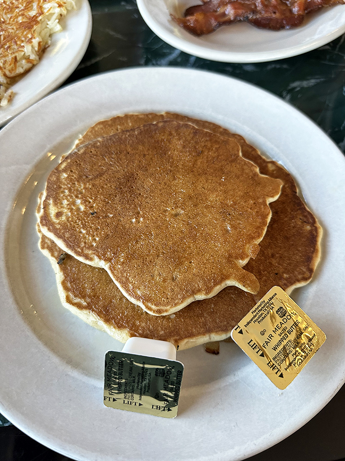 Golden-brown pancakes with a perfect edge crisp—the kind that make you forget all about that diet you were considering yesterday.