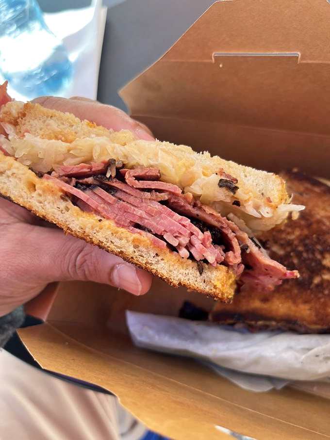 This isn't just a sandwich—it's a pastrami revelation. Thinly sliced, perfectly spiced, and piled high enough to make your cardiologist nervous but your taste buds ecstatic.