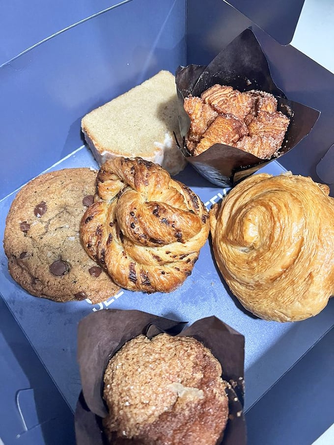 A blue box of joy containing the greatest hits album of pastry perfection—the cookie alone looks like it could solve most of life's immediate problems.
