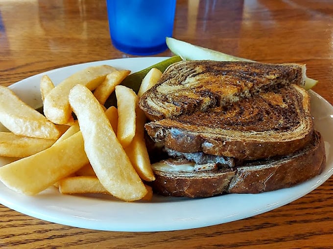 This isn't just a patty melt—it's a masterclass in the marriage of toasted marble rye, melted cheese, and perfectly seasoned beef. Comfort food royalty.