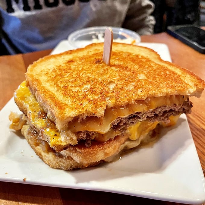 Behold the patty melt—where grilled sourdough, melted cheese, and beef unite in a sandwich that would make your cardiologist wince and your taste buds applaud.