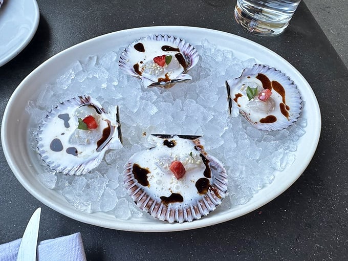 Scallop crudo on ice—nature's candy from the sea. These delicate morsels get dressed up with just enough accoutrements to make them sing.