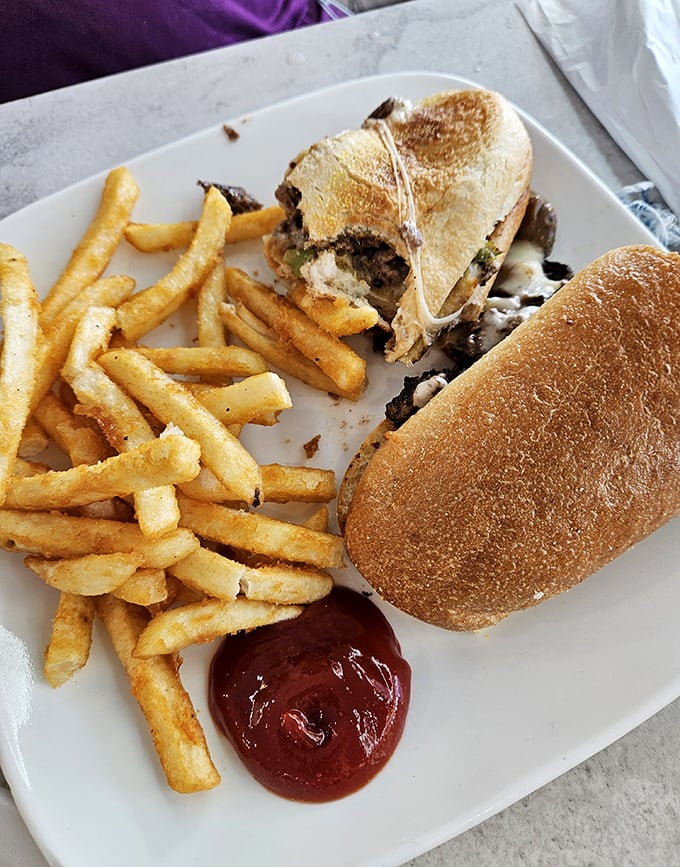 A Philly cheesesteak that traveled south and found its beach body. Golden fries and a splash of ketchup complete this vacation indulgence.