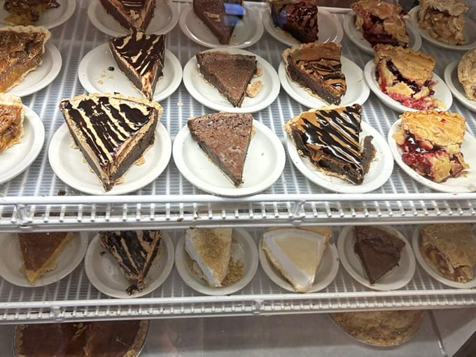 The pie case – where diets go to die and happiness begins. Each slice represents someone's grandmother's recipe perfected over decades.