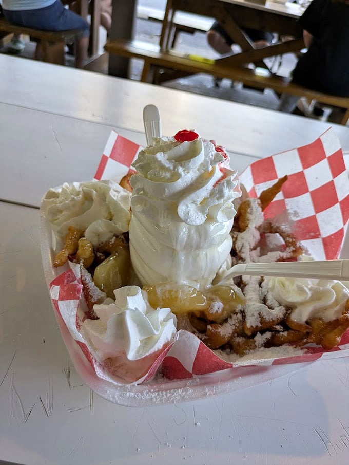 A pineapple upside-down sundae that defies gravity and good sense—yet somehow makes perfect sense when you’re holding a spoon and contemplating happiness.