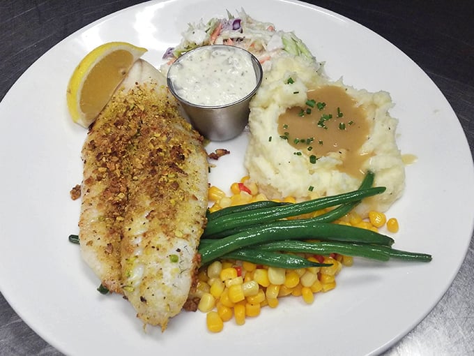 Pistachio-crusted walleye with mashed potatoes and seasonal vegetables—Minnesota's lake-to-plate philosophy at its most delicious.