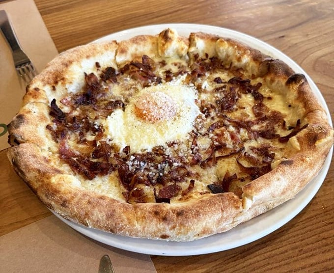 Wood-fired perfection with a blistered crust that crackles like vinyl records. This pizza isn't just food—it's edible architecture.