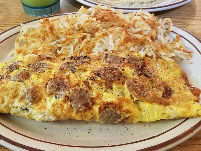 This isn't just an omelet—it's a morning masterpiece that puts your fancy avocado toast to shame. Paired with hash browns that crackle with potential.