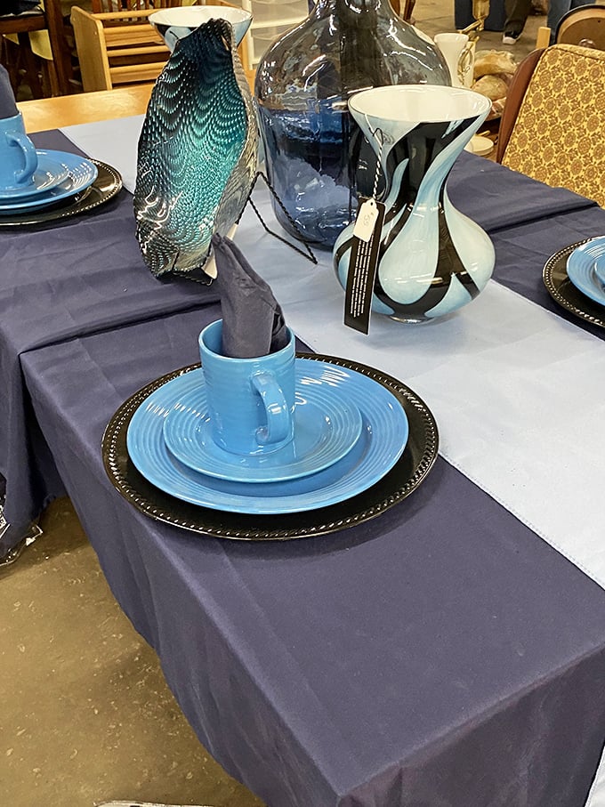 Table settings that would make Martha Stewart do a double-take – coastal blues against navy create unexpected elegance.