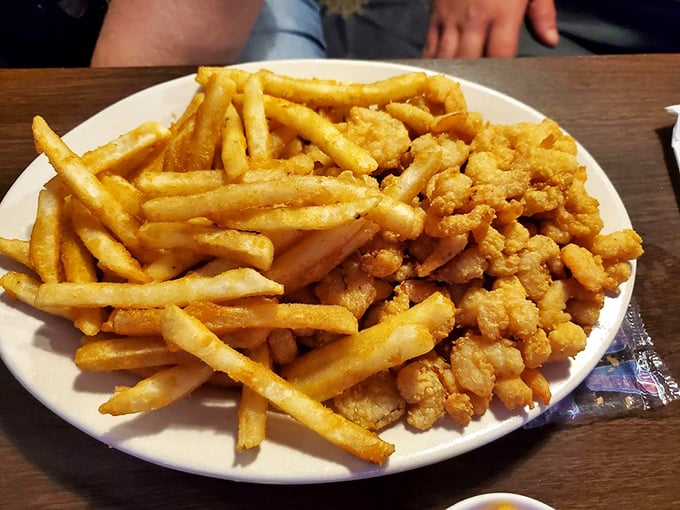 Golden-fried popcorn shrimp nestled against crispy fries—comfort food with coastal flair. Simple pleasures that remind us why we fell in love with seafood in the first place.