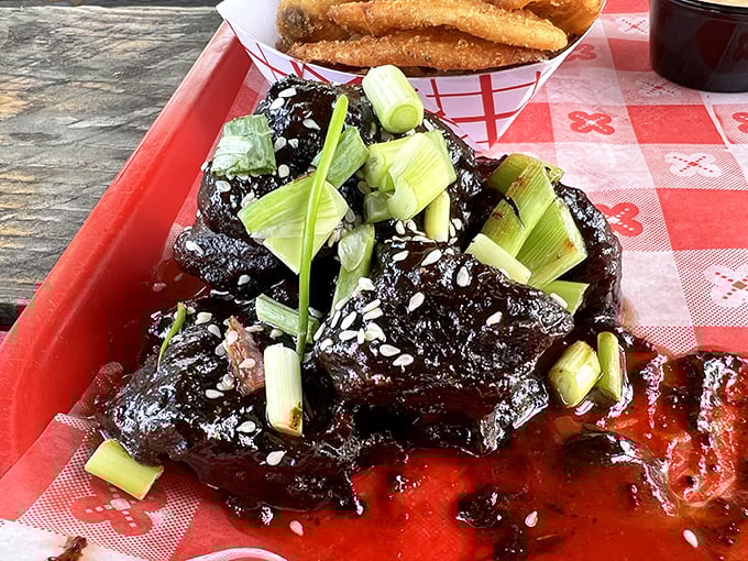 These glistening pork belly burnt ends, lacquered with sauce and topped with scallions, are what barbecue dreams are made of.