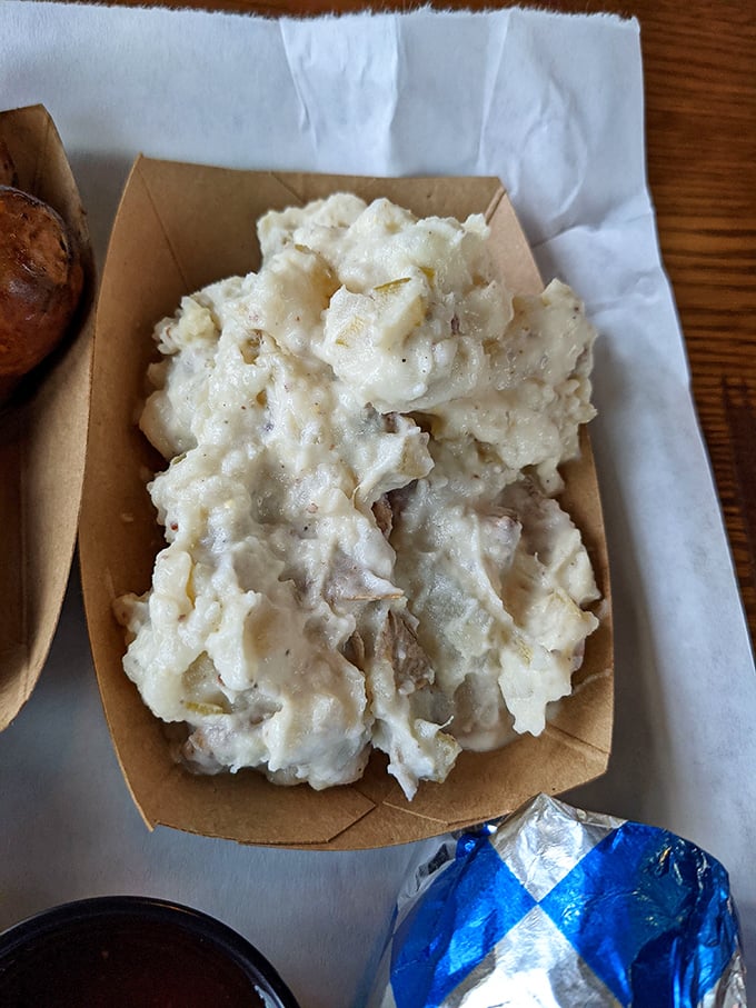 Potato salad that doesn't mess around: creamy, substantial, and ready to support its smoky counterparts like a reliable best friend.