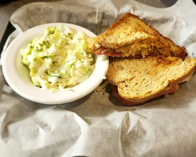 A sandwich and coleslaw that reminds you why simple food, done right, beats fancy cuisine every time. Comfort on a plate, no passport required.