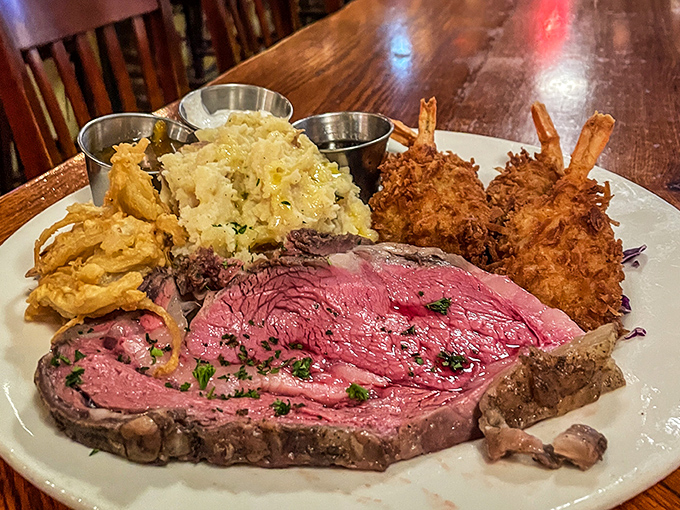Prime rib so perfectly pink it deserves its own Instagram account. Those coconut shrimp companions aren't just sidekicks—they're co-stars.