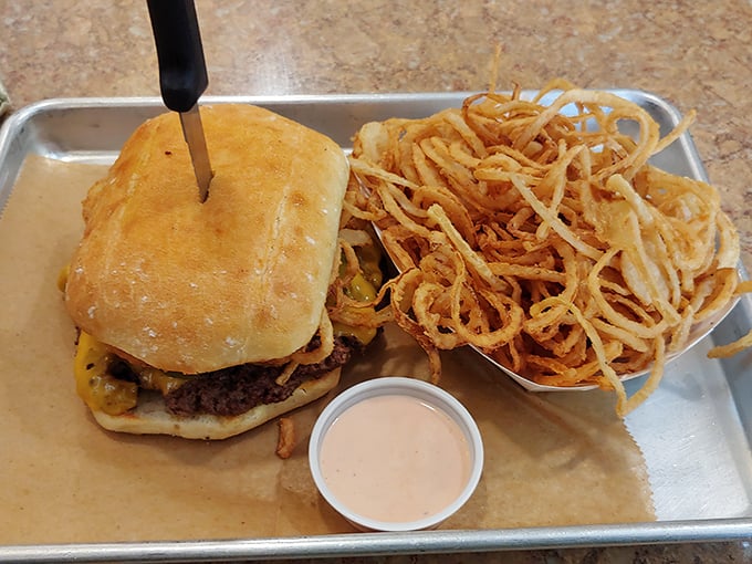 A burger and those string-thin onion rings—a partnership more legendary than Packers football and cheese hats in this corner of Wisconsin.