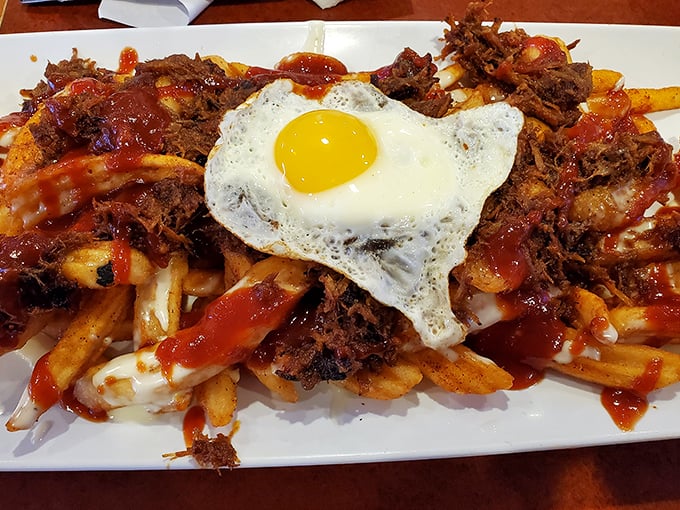 Pulled pork poutine topped with a sunny-side-up egg – because sometimes breakfast and dinner need to have a beautiful reunion.