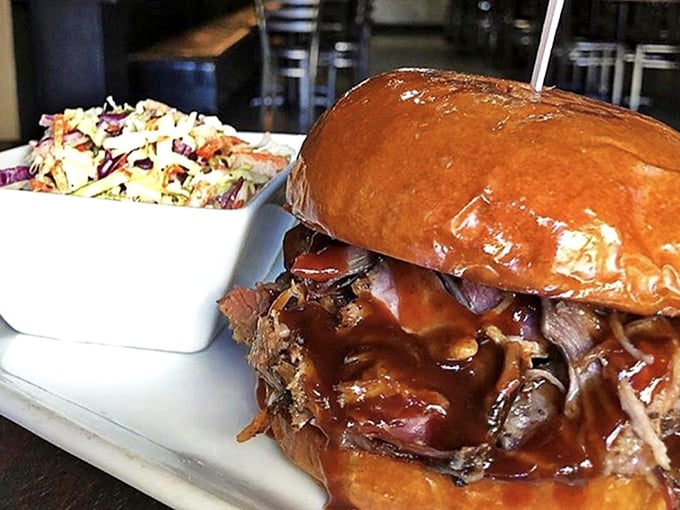 A pulled pork sandwich that doesn't mess around – just gloriously tender meat, sauce with attitude, and coleslaw for that perfect crunch contrast.
