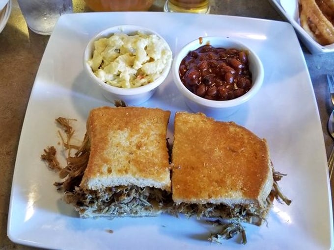 Simple pleasures: pulled pork sandwich with potato salad and beans. Sometimes happiness comes on a white plate with sides.