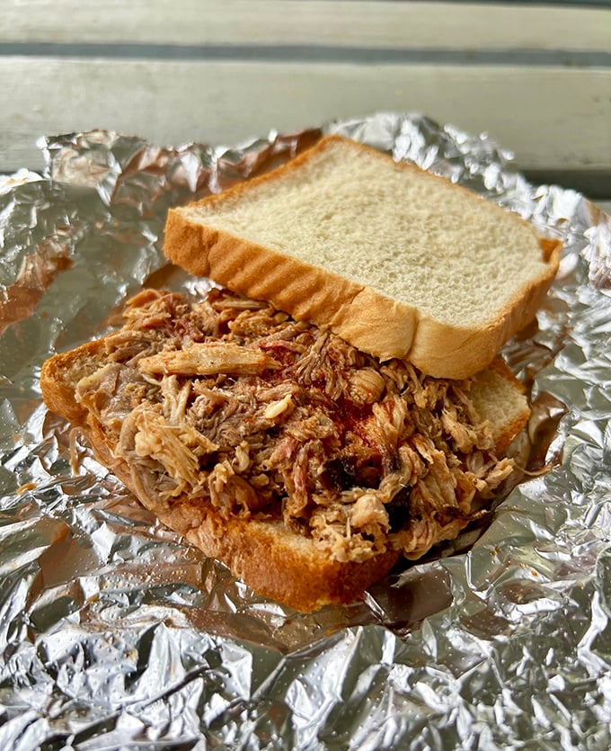 The open-faced sandwich reveals the truth – barbecue this good doesn't need fancy presentation, just enough bread to get it from the foil to your mouth.