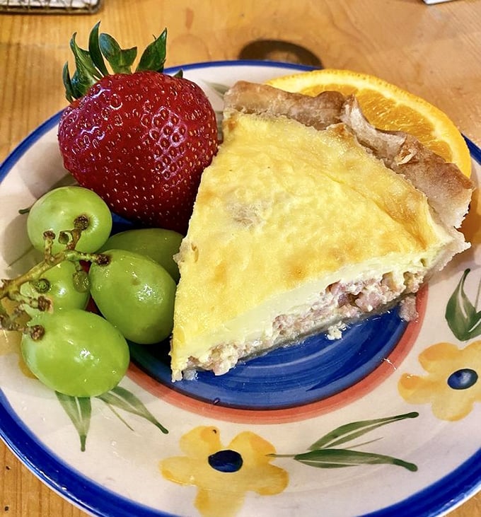 Quiche and fresh fruit—the power couple of brunch that makes you feel simultaneously indulgent and virtuous. That's balance, folks.