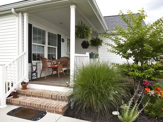 Front porch perfection with rocking chair potential—the kind of entrance that practically demands you slow down and stay awhile.