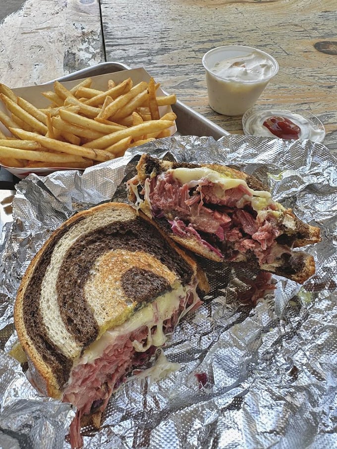 The Reuben sandwich – where smoked meat meets melty cheese in a dance so beautiful it deserves its own soundtrack.