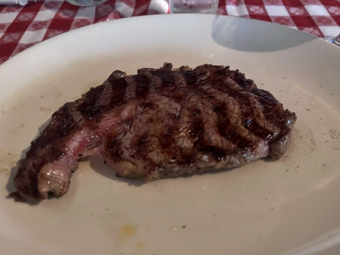 Meat poetry on a plate. The cross-hatched grill marks on this ribeye are like a carnivore's sonnet – beautiful, precise, and worth savoring slowly.