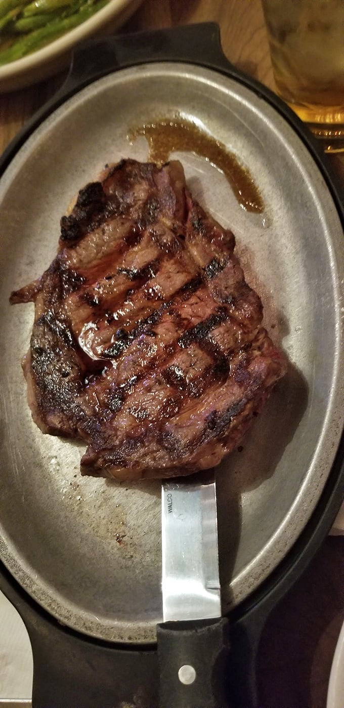 Behold the ribeye—a carnivore's dream on a sizzling platter. Those grill marks aren't just decoration; they're a roadmap to flavor town.