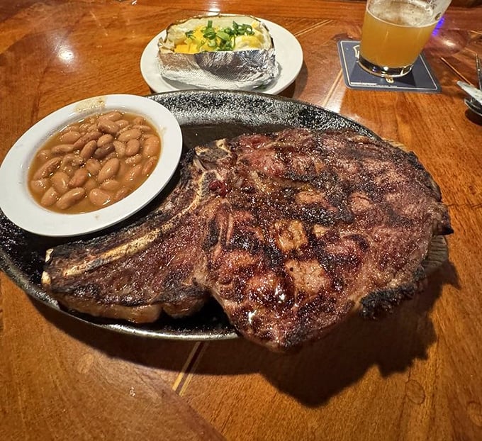 Behold the ribeye in its natural habitat – charred exterior, juicy interior, and a bone that says, "Yes, this was once a magnificent creature."