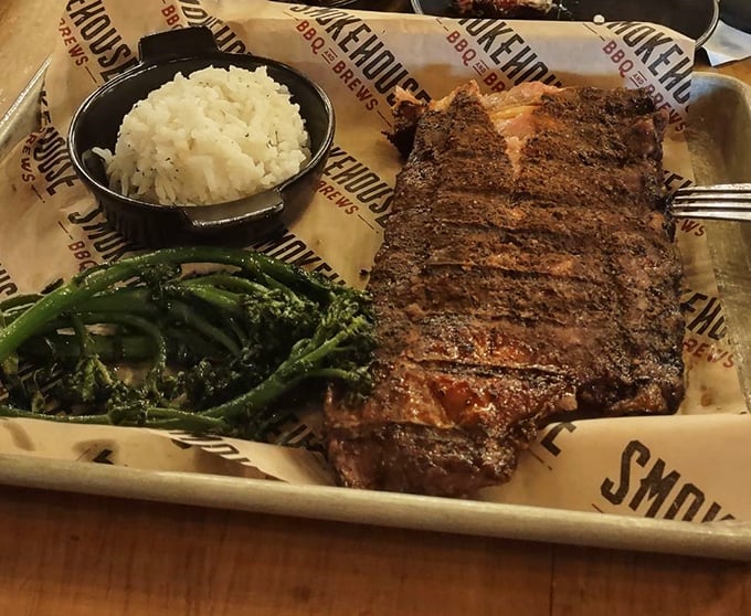 Behold the barbecue trinity: perfectly smoked ribs, creamy mashed potatoes, and vibrant greens – a balanced meal for unbalanced times.